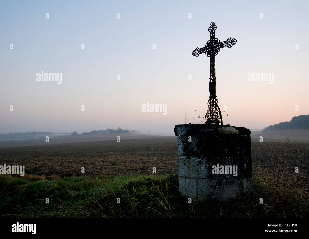 Roadside cross at dusk - France Stock Photo - Alamy