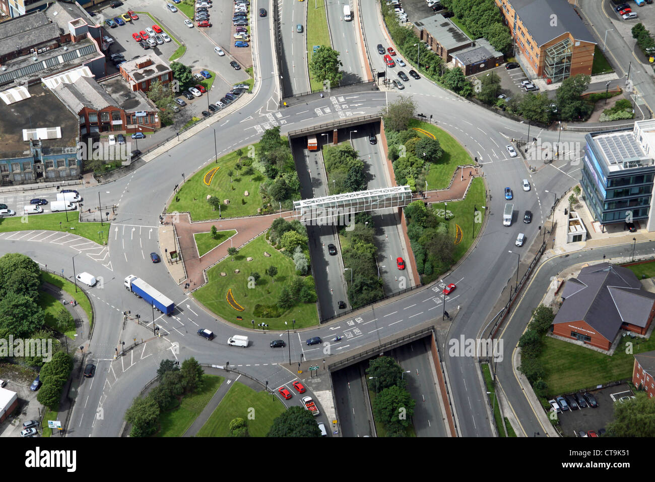 aerial view of a large roundabout over a dual carriageway road with ...