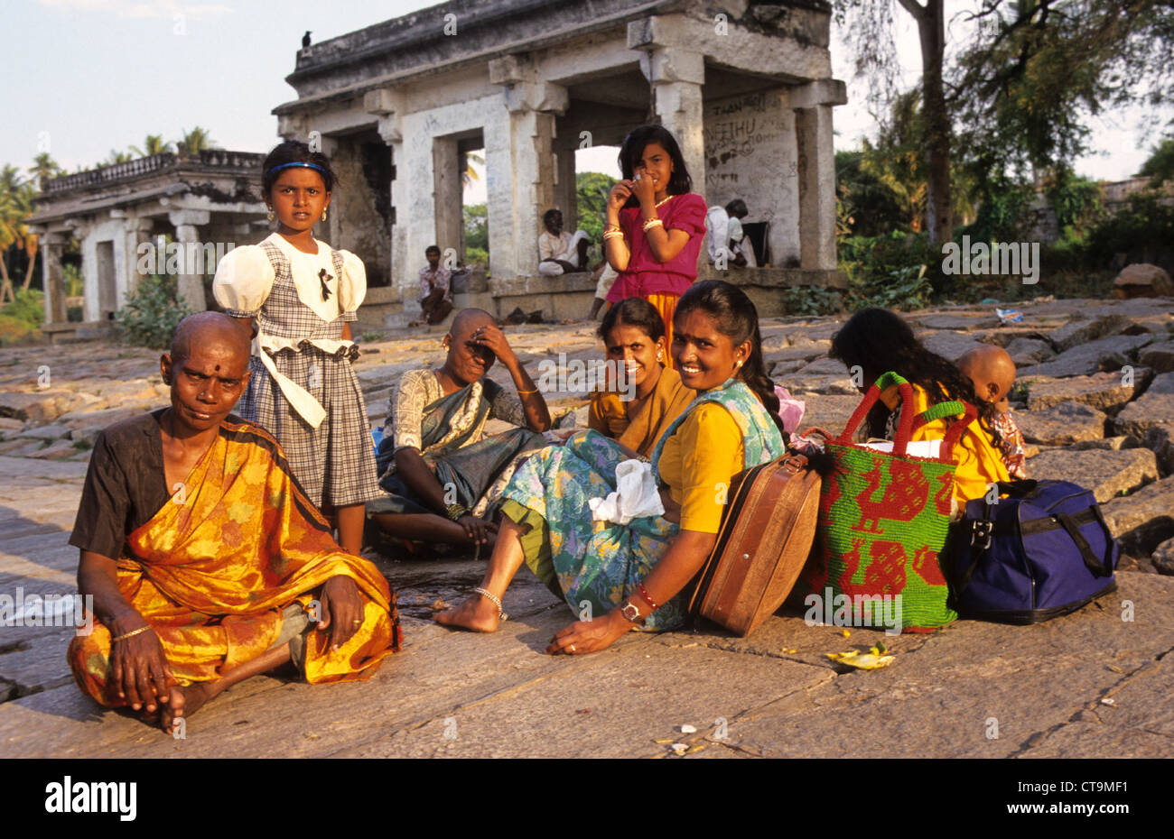 Indian women with children in front of an ancient temple Stock Photo ...