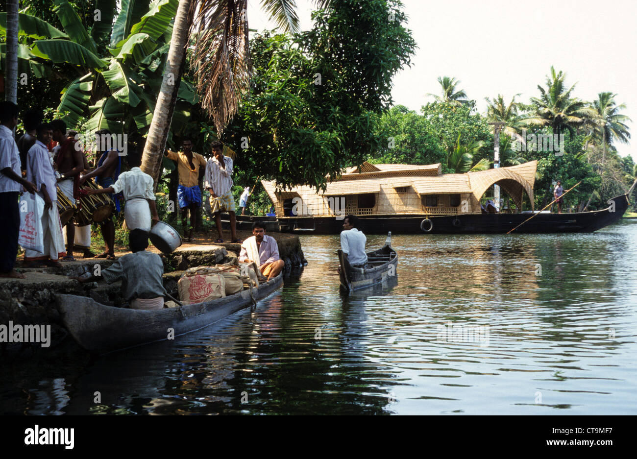 Boats and people on a backwater canal Stock Photo - Alamy Boats and people on a backwater canal Stock Photo - Alamy
