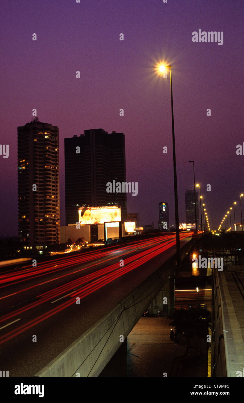 Bangkok, red streaks of light in purple sky Stock Photo - Alamy