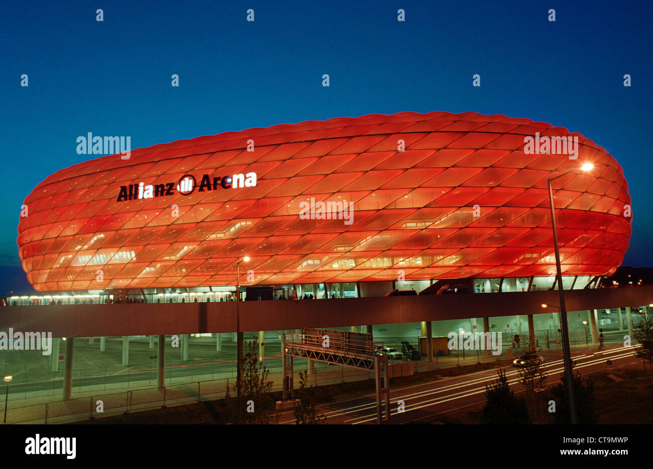 Red-orange illuminated Allianz Arena at night Stock Photo - Alamy