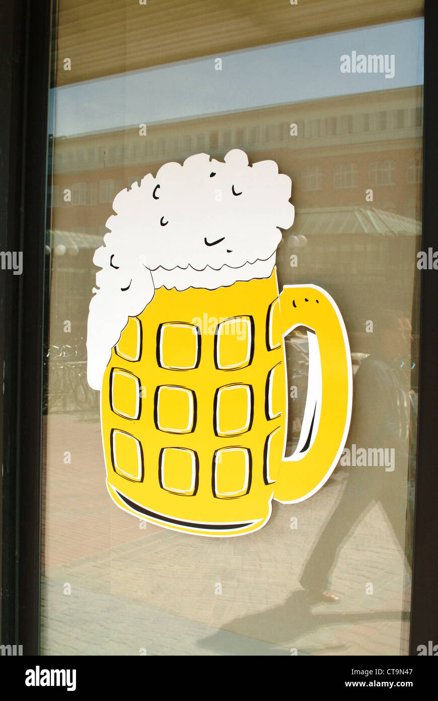 Beer glass on a window pane Stock Photo - Alamy