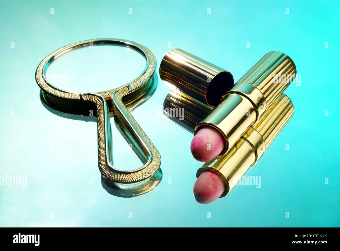 Lipstick next to a mirror Stock Photo - Alamy