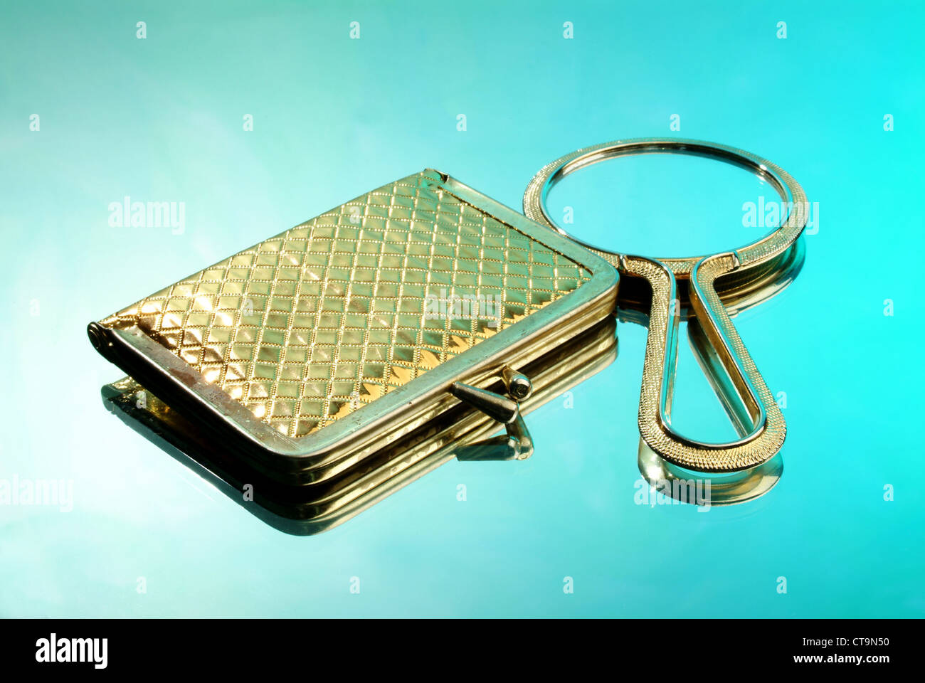 Wallet and makeup mirror Stock Photo - Alamy