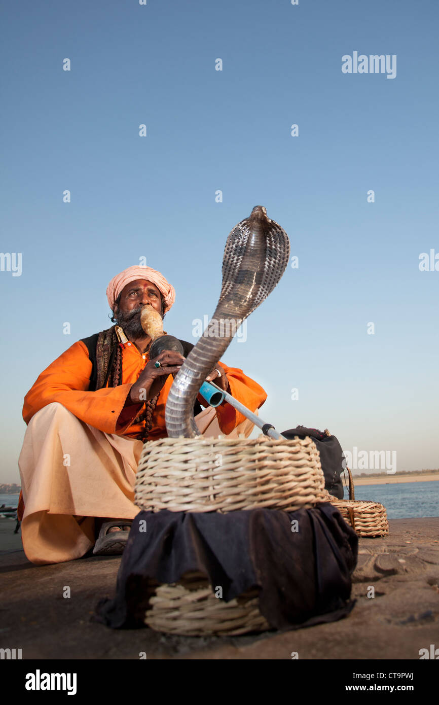 Indian Hindu culture, Cobra charmer with flute, Varanasi, Uttar Pradesh ...