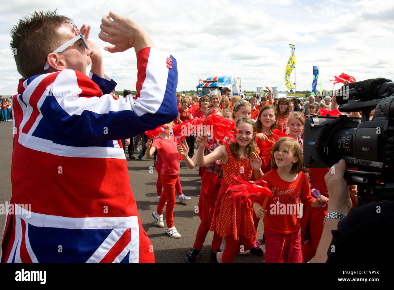 Character dressed in a Union Jack suit entertains participants in the ...