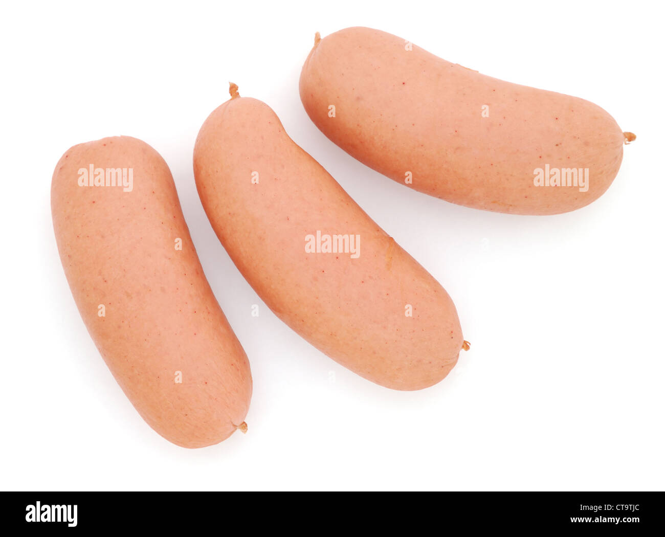 Three small sausages isolated on white background Stock Photo - Alamy