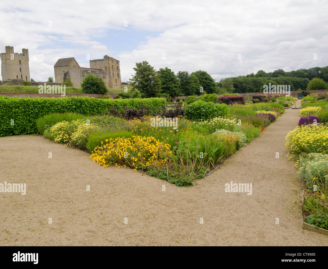 Helmsley Castle overlooking the Helmsley Walled Garden with a show of ...