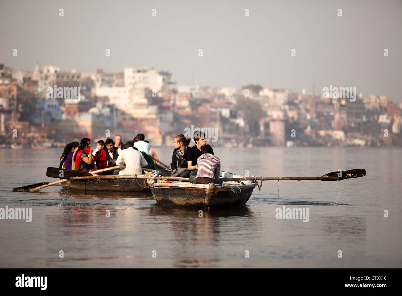 Pilgrims are on the boat for looking holy river Ganga(Ganges), Varanasi ...
