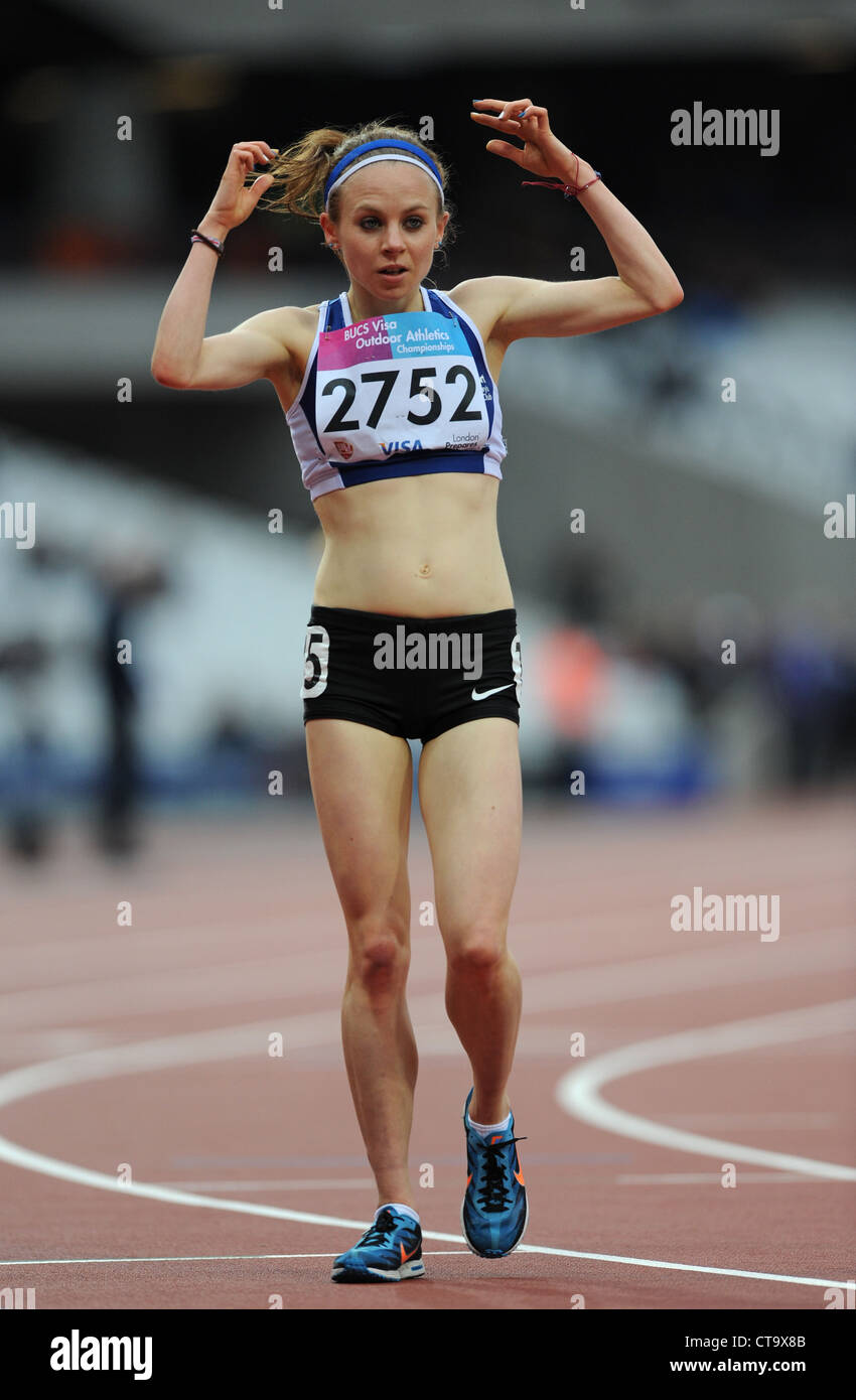 An Athlete celebrates winning on a running track Stock Photo - Alamy