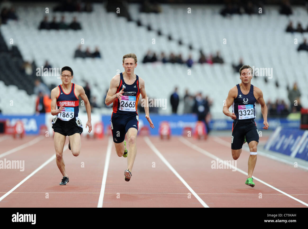 Sprinters competing on a running track Stock Photo - Alamy
