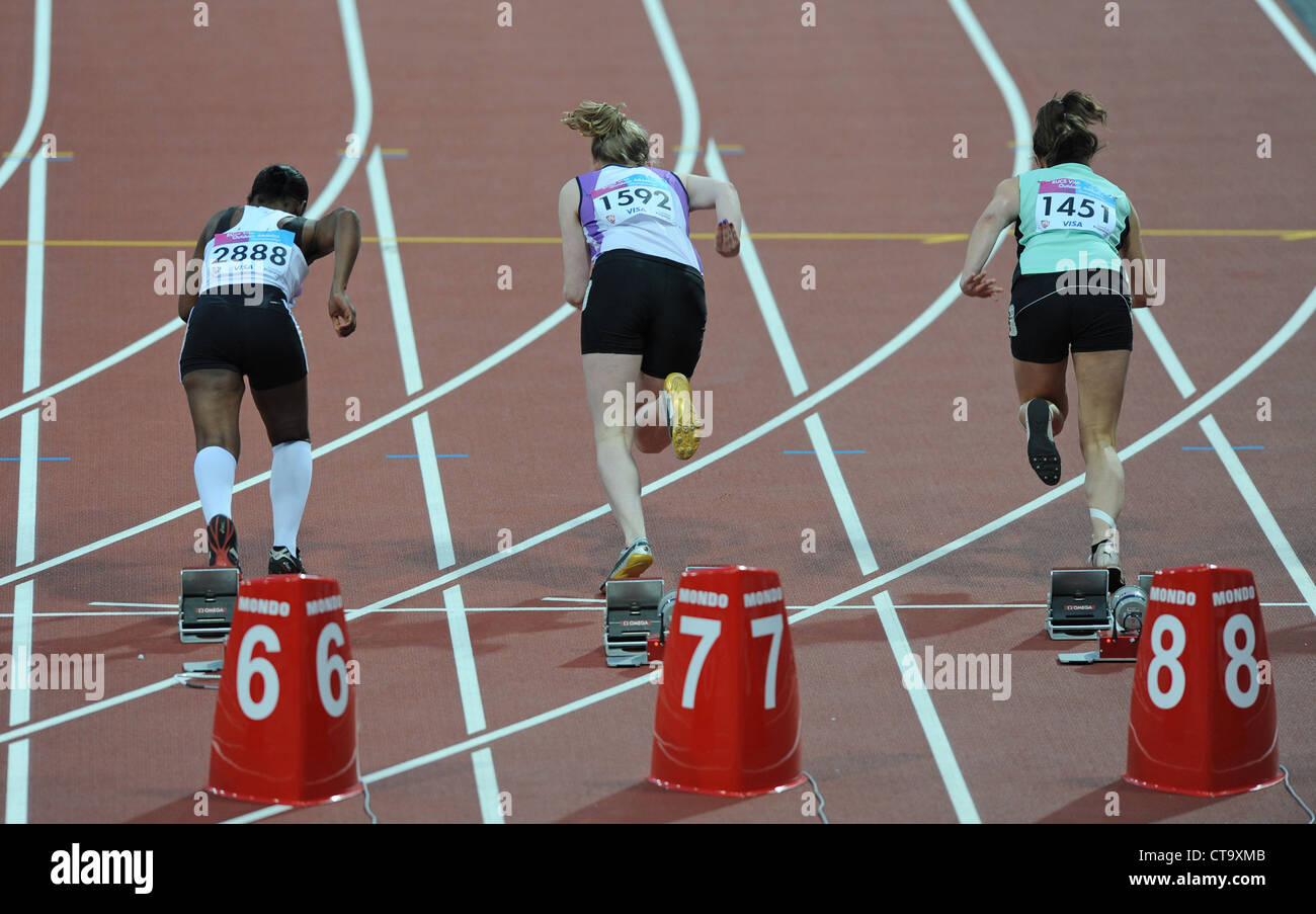 Athletes competing on a running track Stock Photo - Alamy