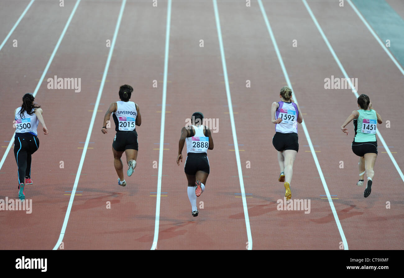 Athletes competing on a running track Stock Photo - Alamy