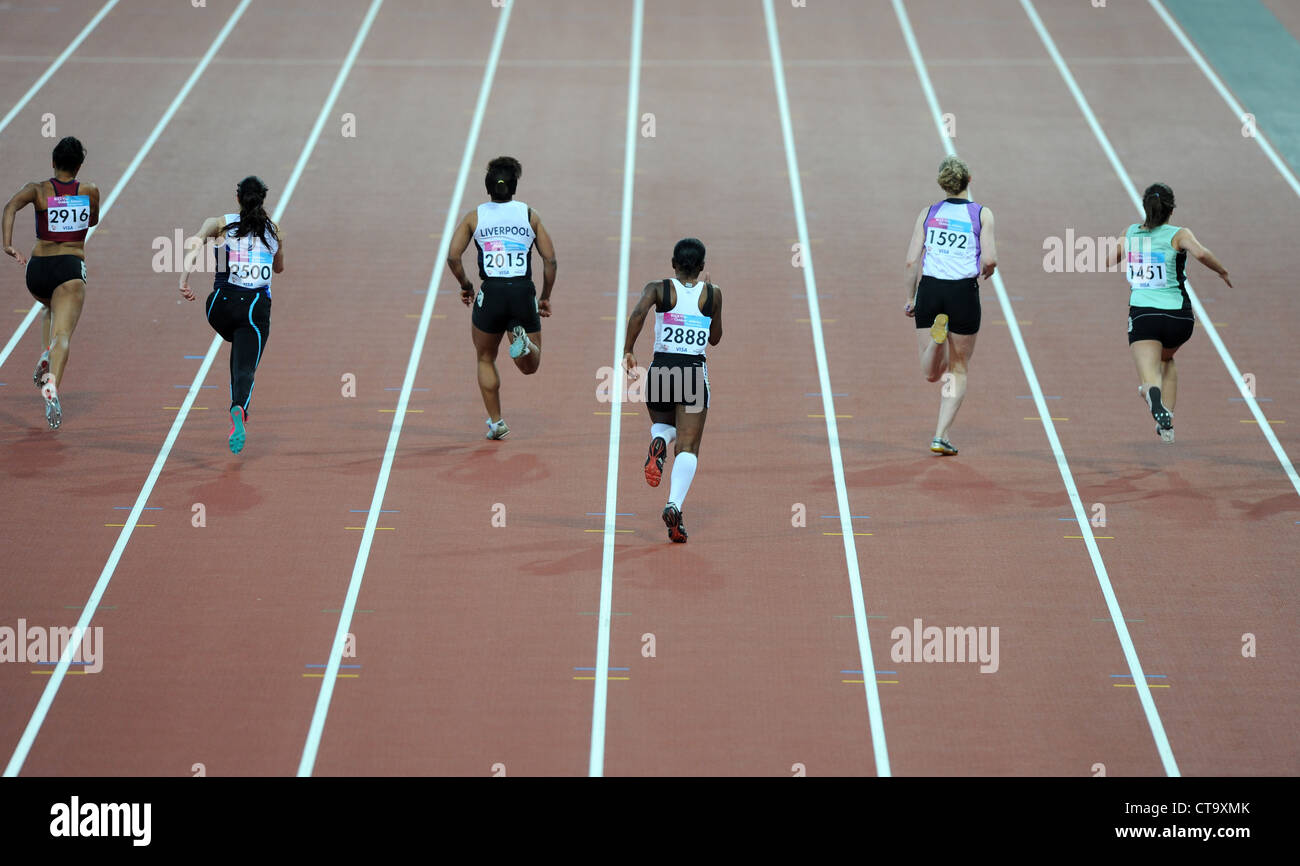 Athletes competing on a running track Stock Photo - Alamy