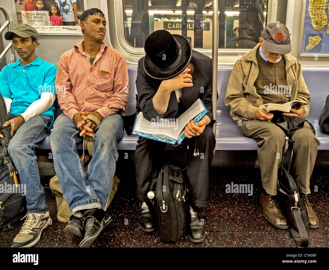 Orthodox Jew reads a book in Hebrew, an elderly man reads a paperback ...