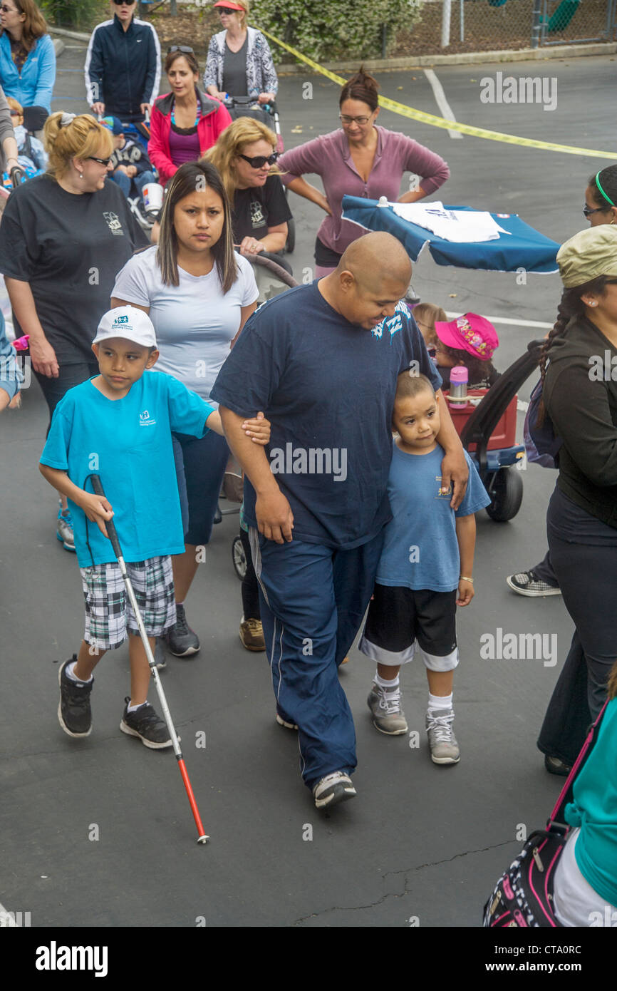 Guiding blind child hi-res stock photography and images - Alamy