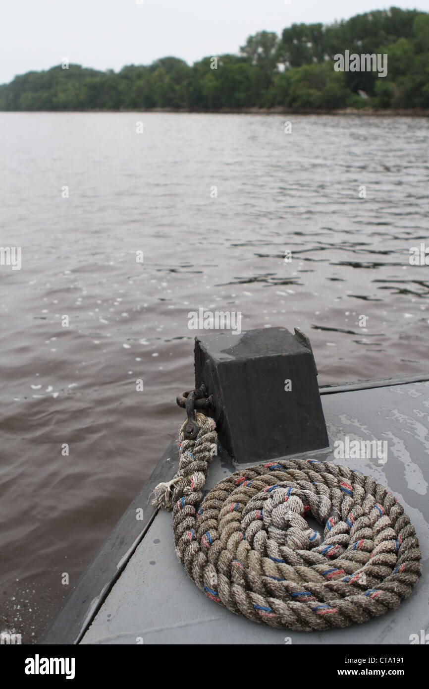 A rope coiled on a boat on the water Stock Photo - Alamy