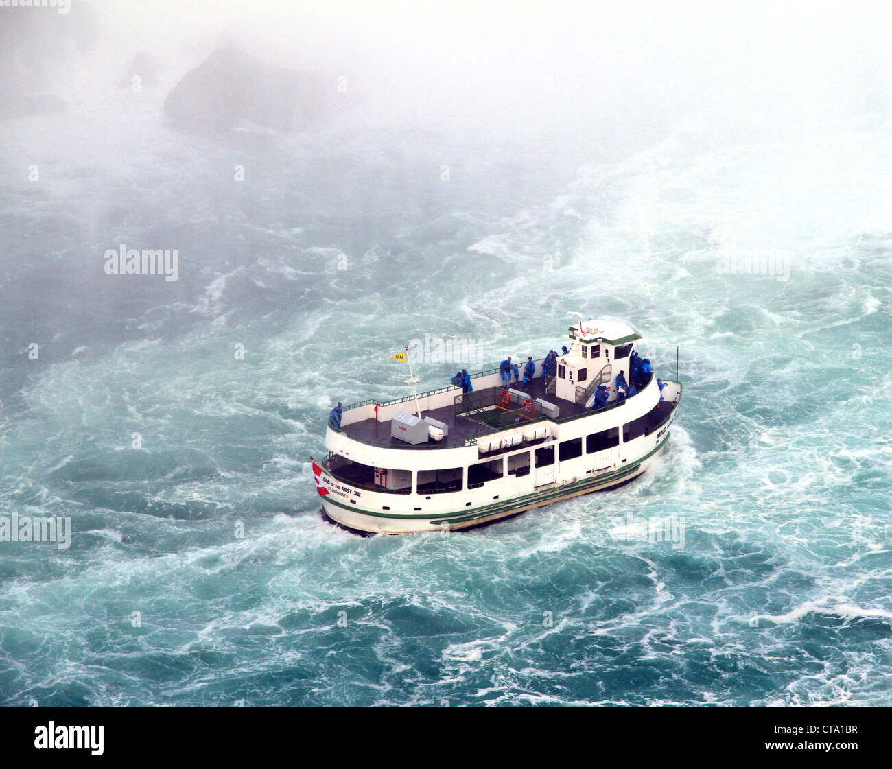 A ferry from the Maid of the Mist boat trip under the Niagara Falls ...