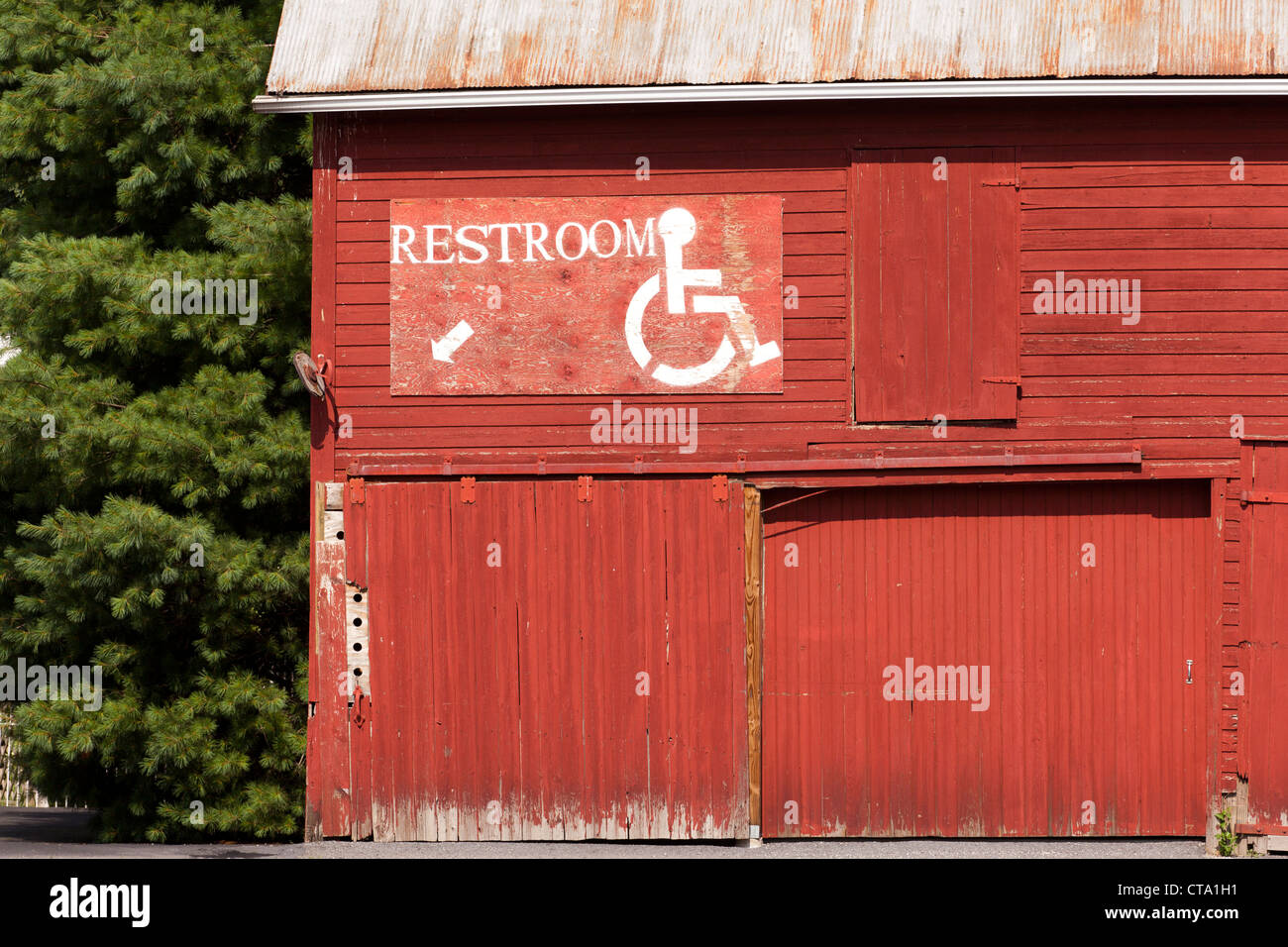 Restroom sign on side of barn Stock Photo - Alamy