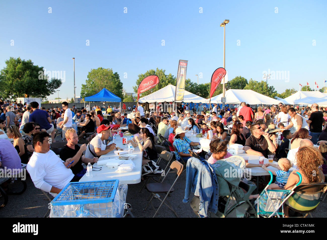 Crowd eating during the annual Rotary Club Ribfest in Markham, Ontario ...