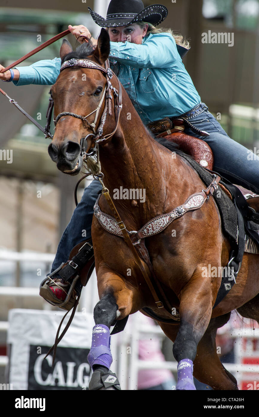 Woman's barrel race event at the Calgary Stampede Rodeo Stock Photo - Alamy