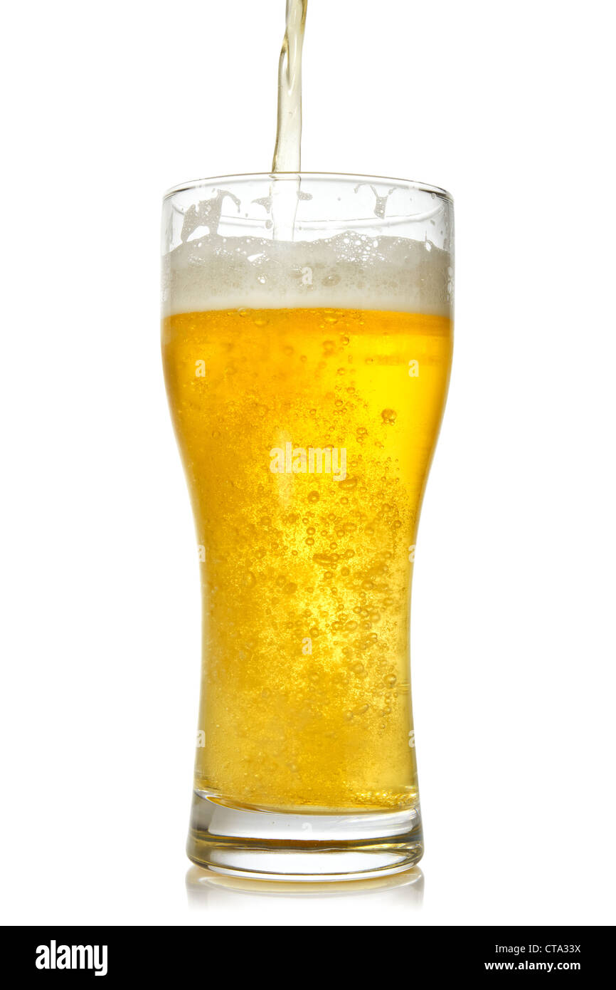 Cold beer pouring into glass. Isolated on white background Stock Photo ...