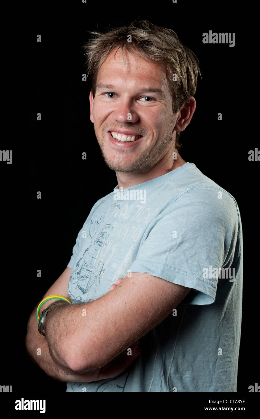 Young man smiling Stock Photo - Alamy
