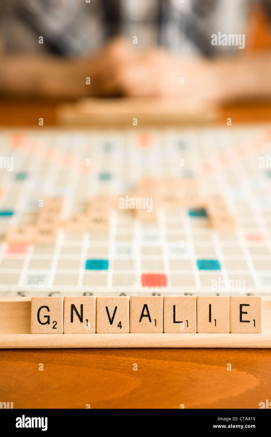 man playing scrabble Stock Photo - Alamy