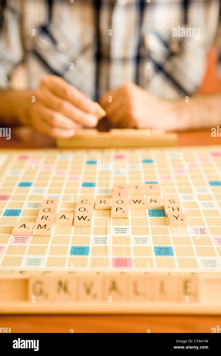 man playing scrabble Stock Photo - Alamy