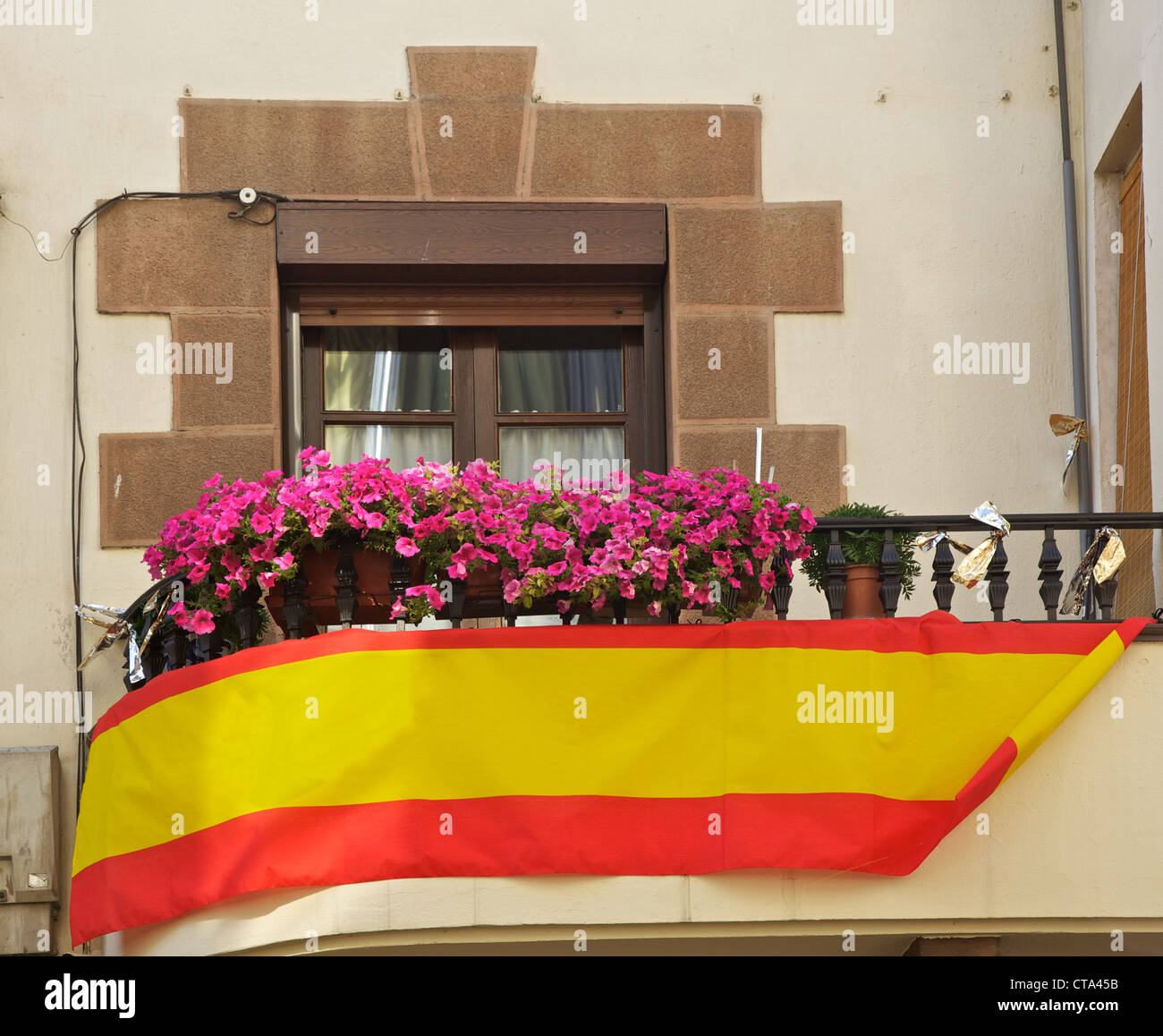 Spanish balcony with support flag Stock Photo - Alamy