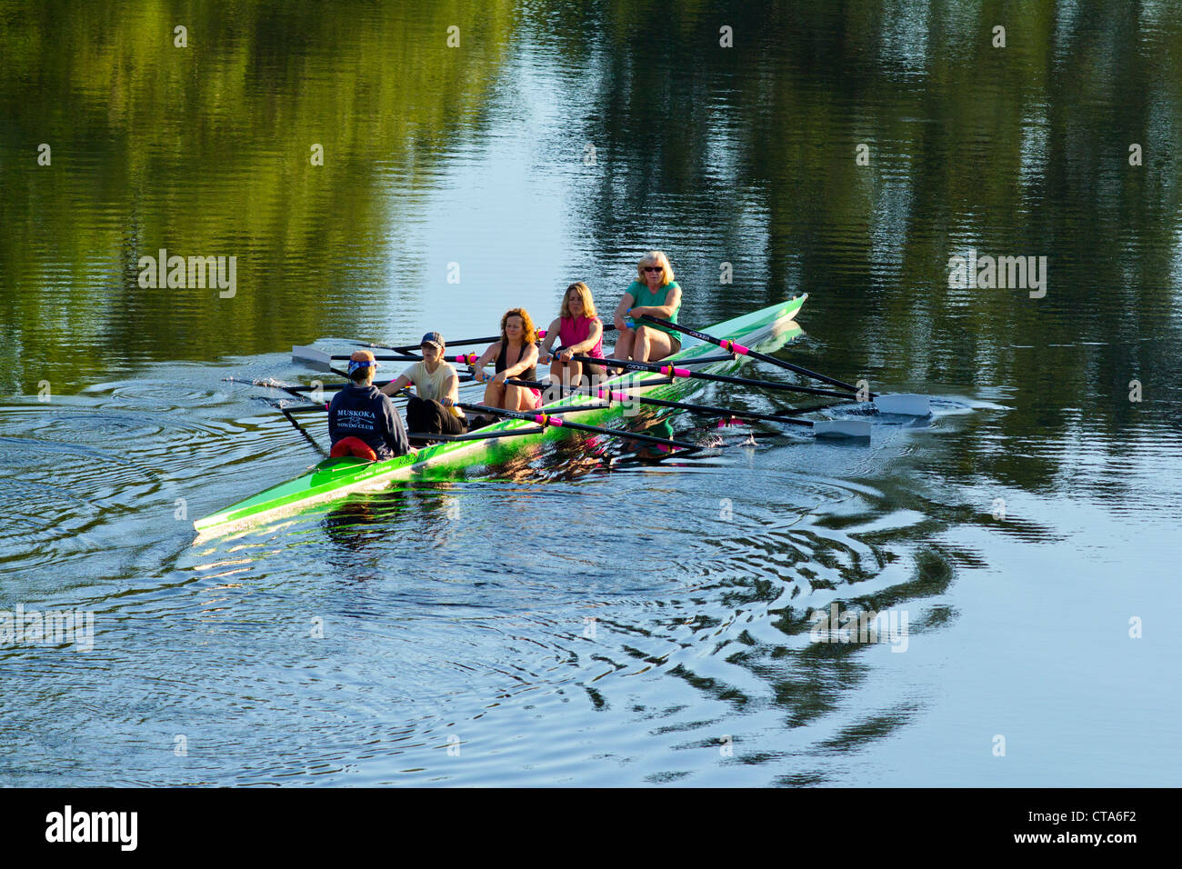 Women rowing a boat Stock Photo - Alamy