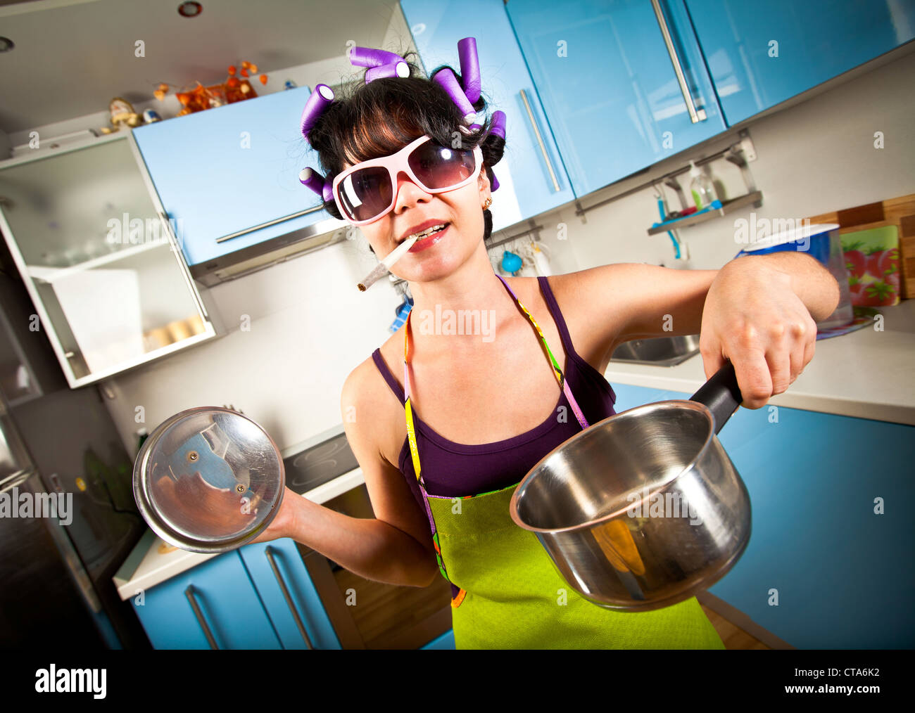 crazy housewife in an interior of the kitchen Stock Photo - Alamy