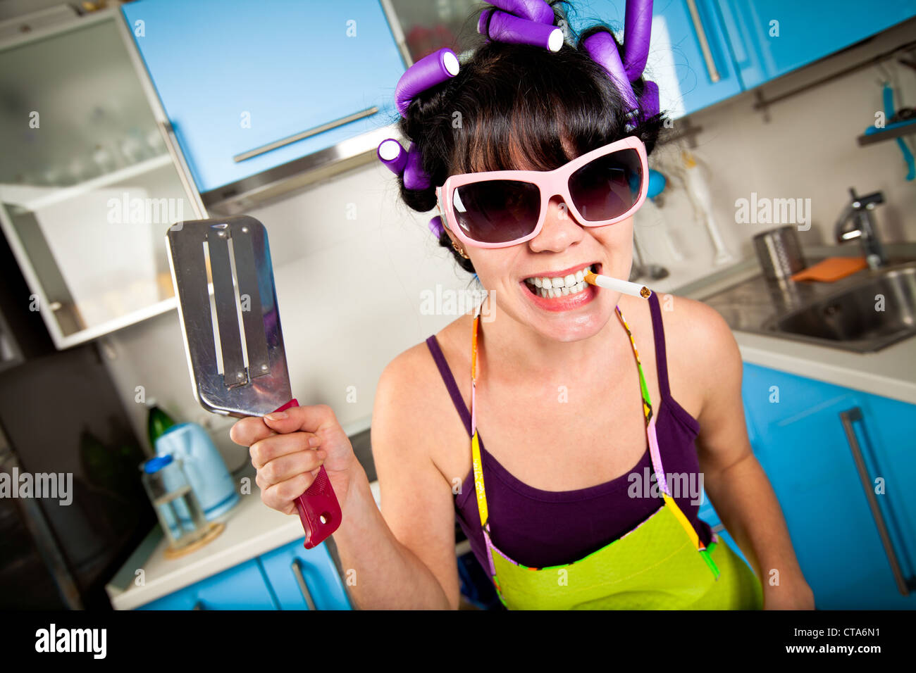 crazy housewife in an interior of the kitchen Stock Photo - Alamy