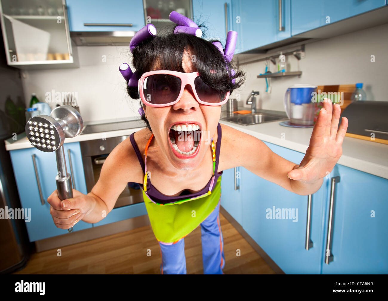 crazy housewife in an interior of the kitchen Stock Photo - Alamy