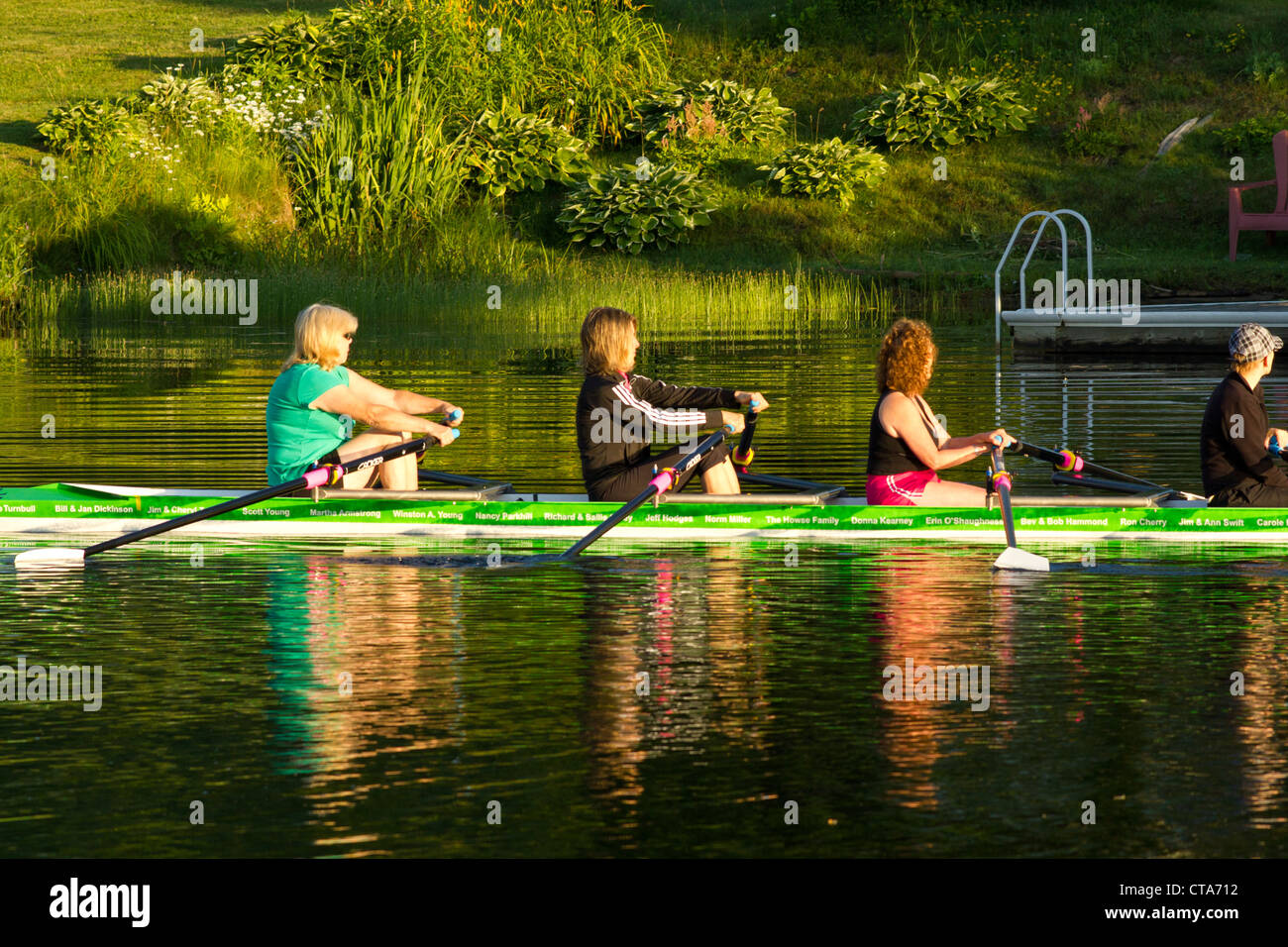 Women in a rowing boat Stock Photo - Alamy