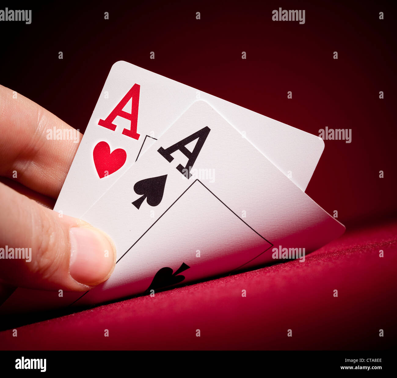 Pockets Aces with plenty of red background for textcopy Stock Photo - Alamy