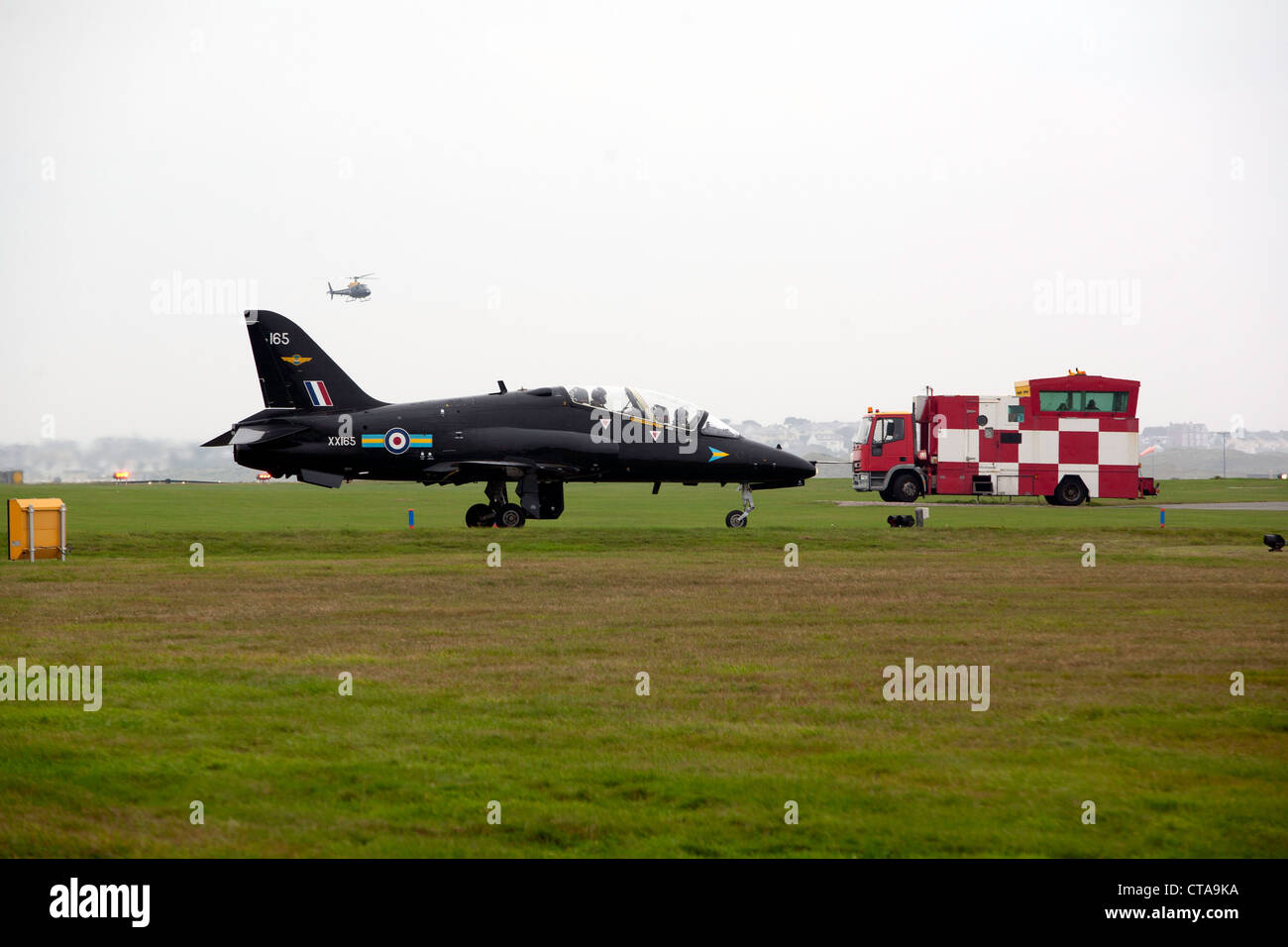 RAF Hawk T1 XX165 of 208 Squadron taxi's past the mobile ATC van at RAF ...