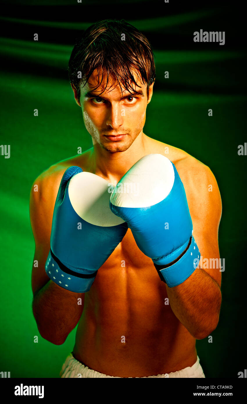 Man sweating all over in boxing gloves Stock Photo - Alamy