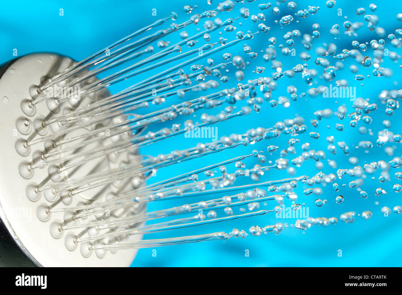 Shower with drops of water on a blue background Stock Photo - Alamy