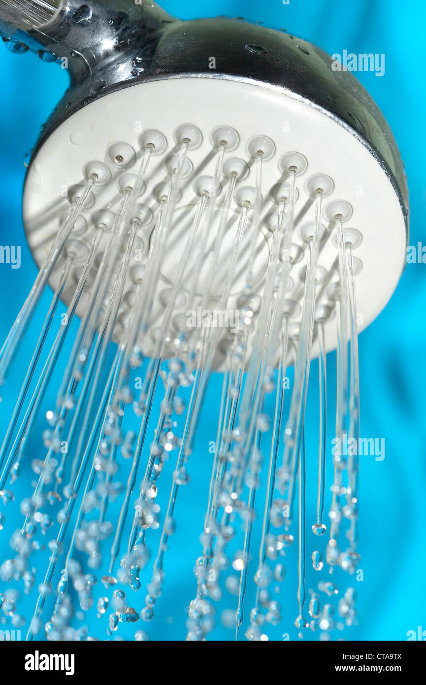 Shower with drops of water on a blue background Stock Photo - Alamy