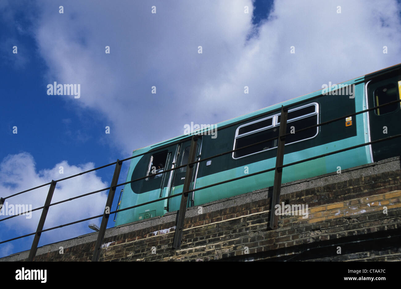 Train going across bridge England UK Stock Photo - Alamy