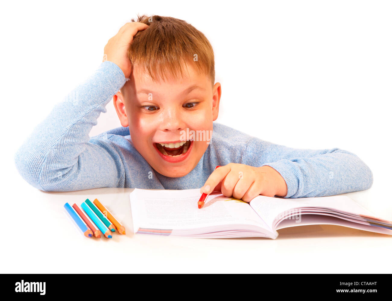 The boy with the book behind a table Stock Photo - Alamy