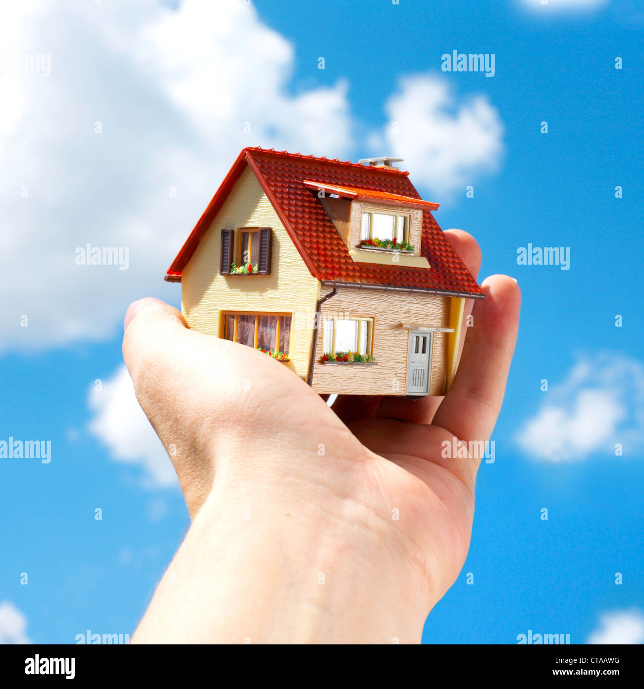 The house in human hands Stock Photo - Alamy