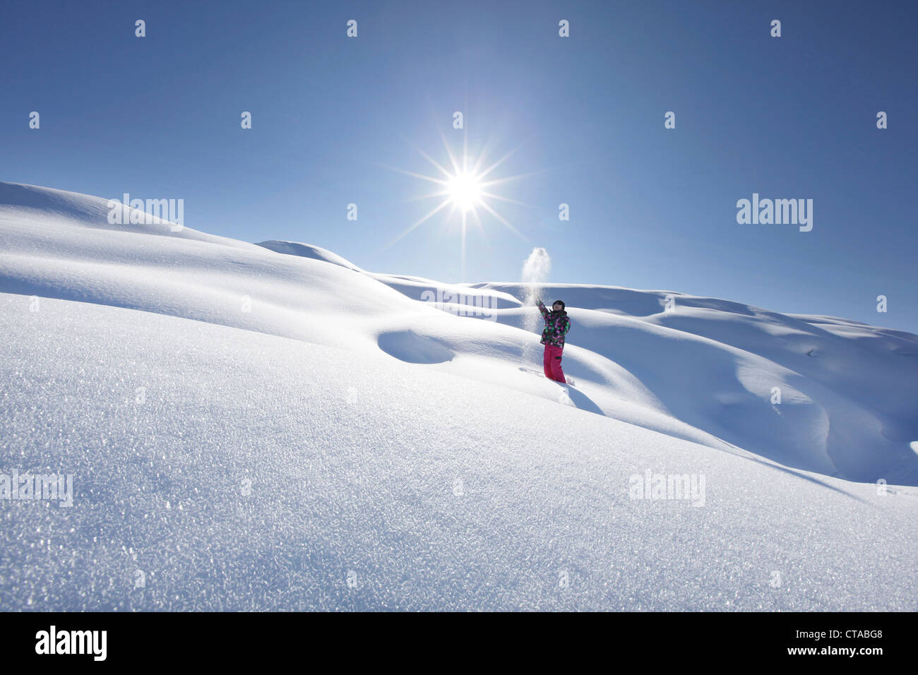 Young girl trudging through deep snow, Kloesterle, Arlberg, Tyrol ...