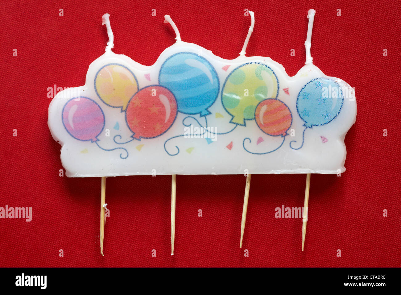 balloons candle ideal for birthday set on red background Stock Photo ...
