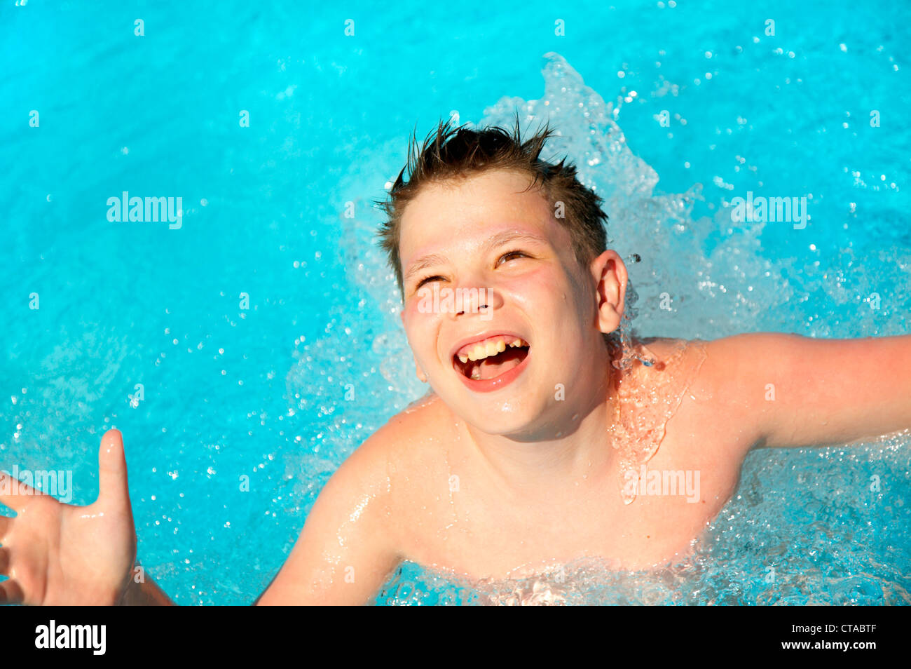 joyful boy in pool. Jump in water Stock Photo - Alamy