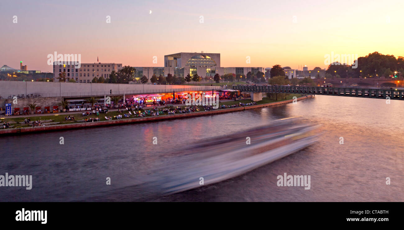 Capital beach cafe and federal chancellery at the river Spree at sunset ...