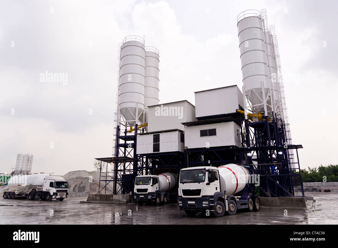 Trucks loading at a Concrete mixing factory Stock Photo - Alamy