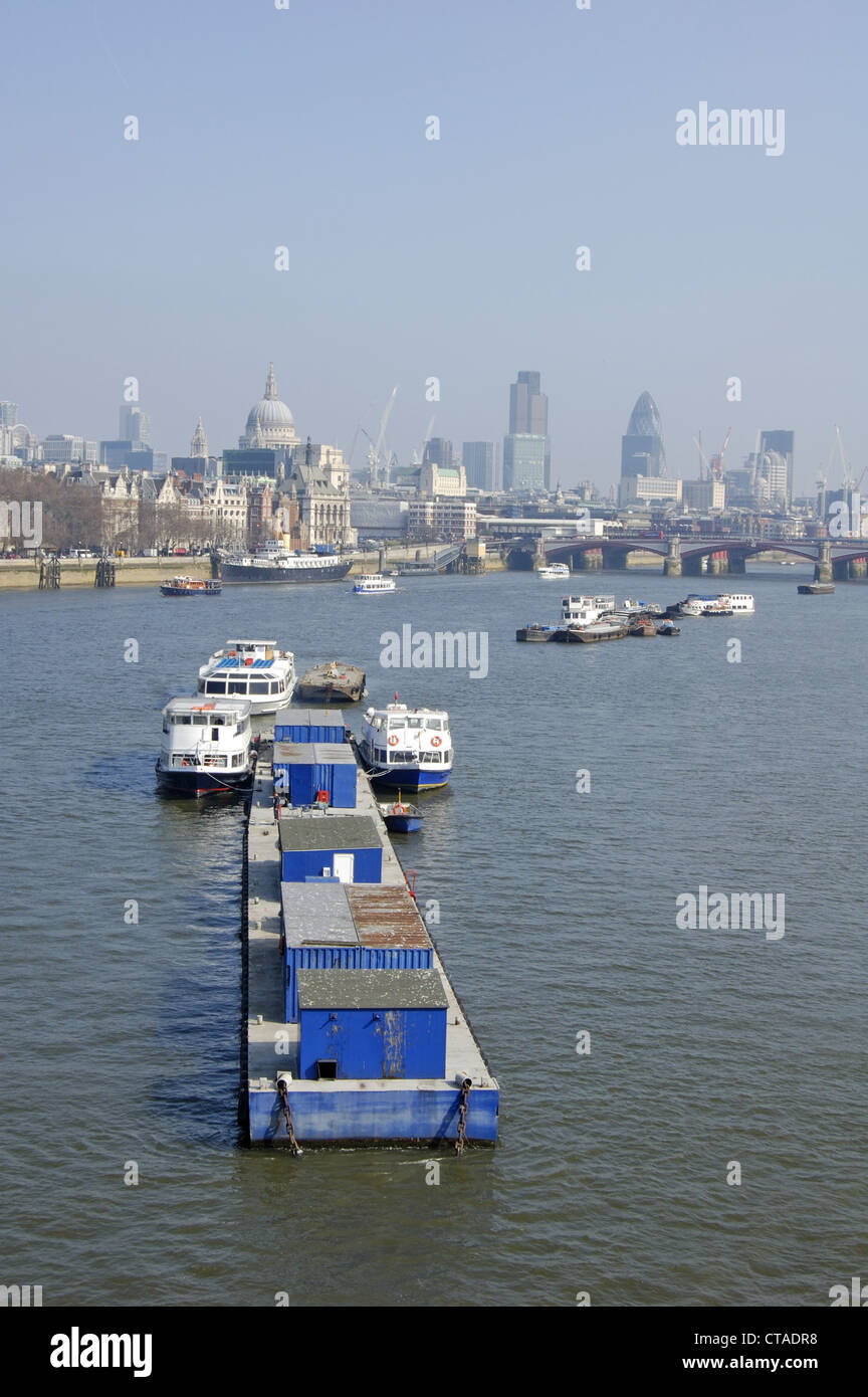 Moorings on the River Thames and City skyline, London, England Stock ...